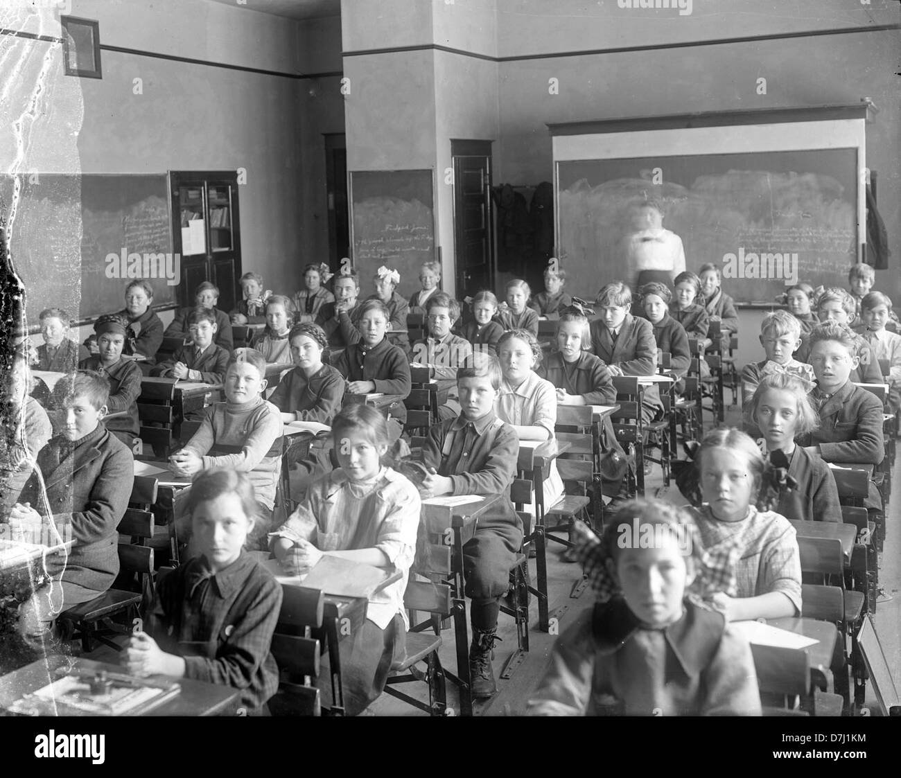 This image captures people interacting in a classroom setting ...