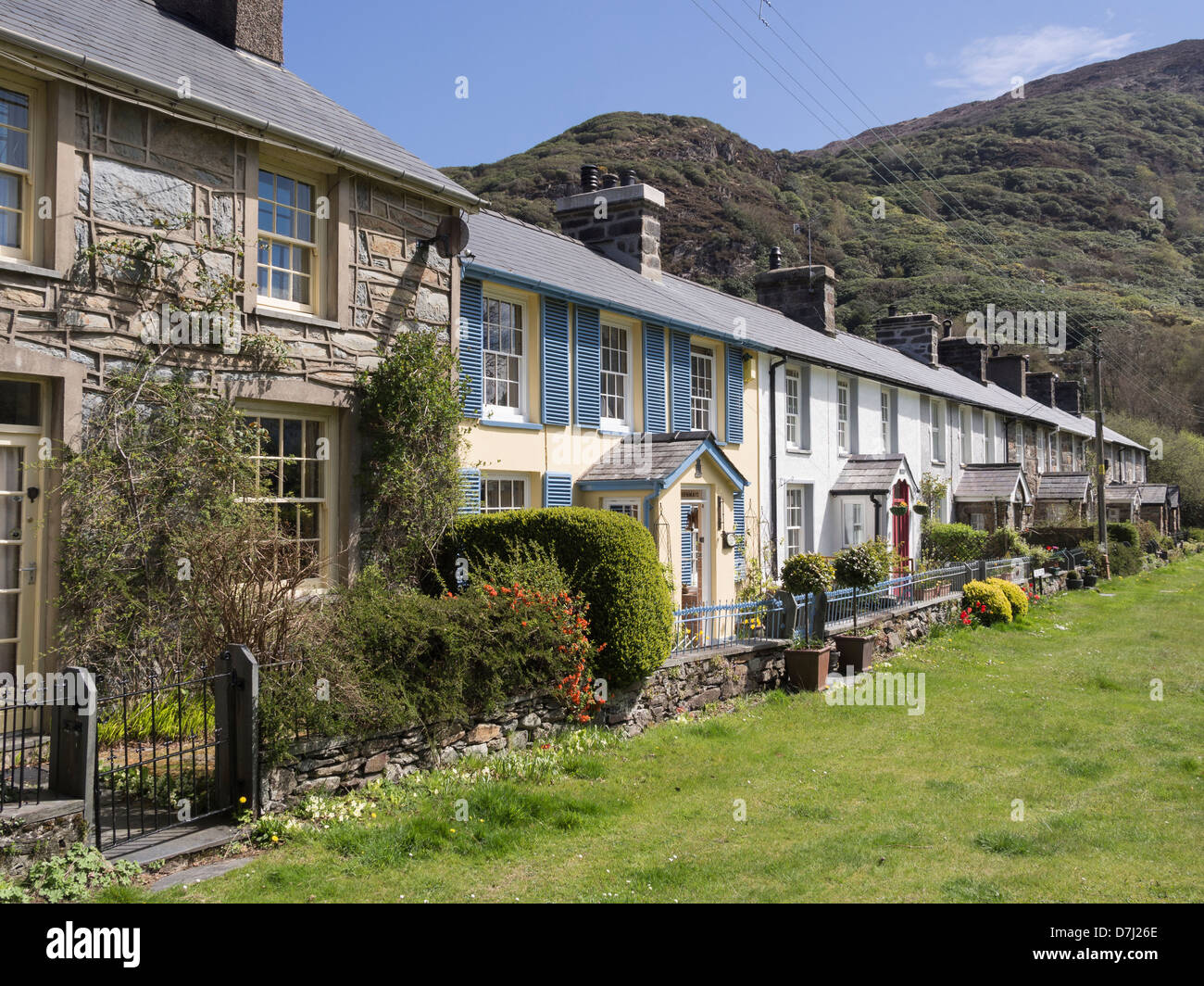 Row of traditional terraced cottages overlooking picturesque Welsh ...