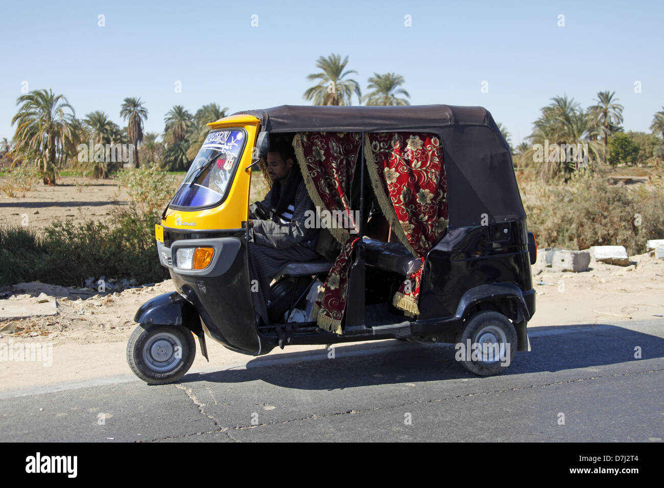 BLACK & YELLOW TUC-TUC NEAR ASWAN EGYPT 11 January 2013 Stock Photo - Alamy
