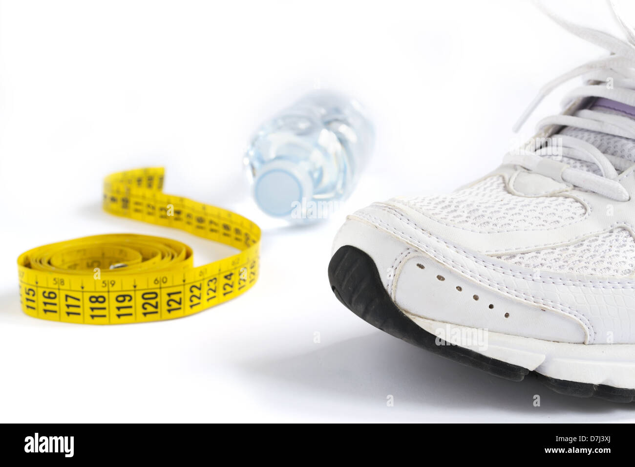 running shoe and meter on white background Stock Photo - Alamy