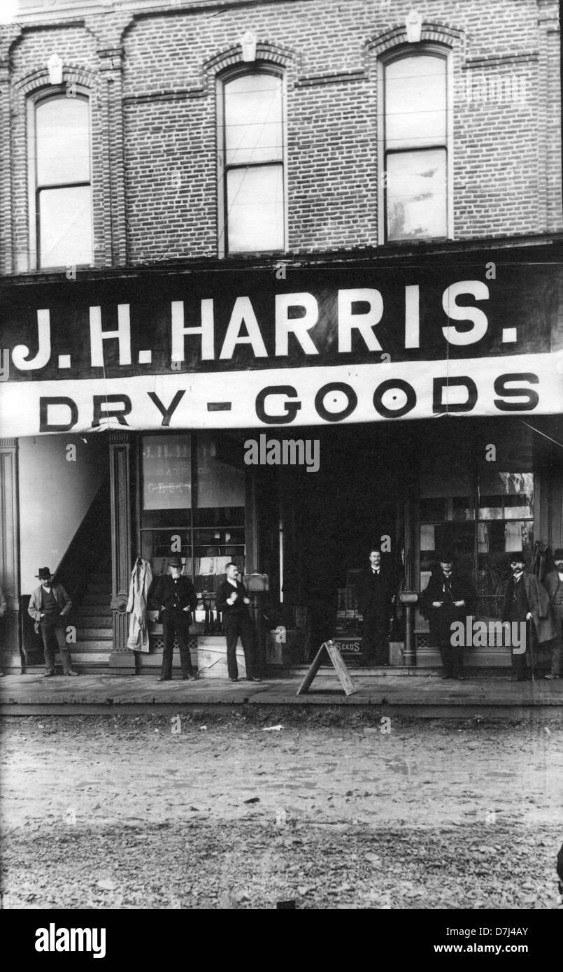 A historical photograph capturing shoppers at the J. H. Harris Dry ...