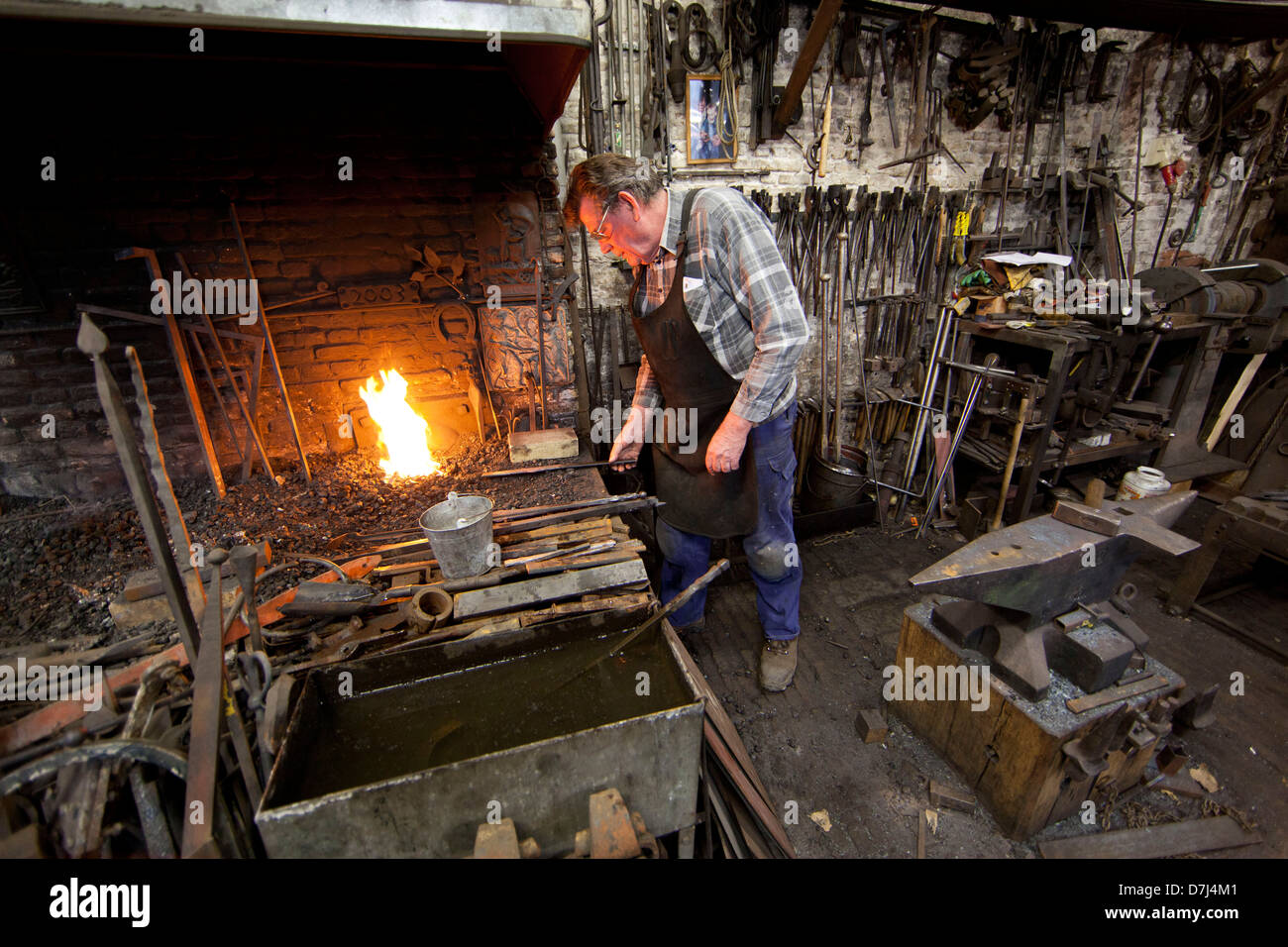 traditional blacksmith at work in Holland Stock Photo - Alamy