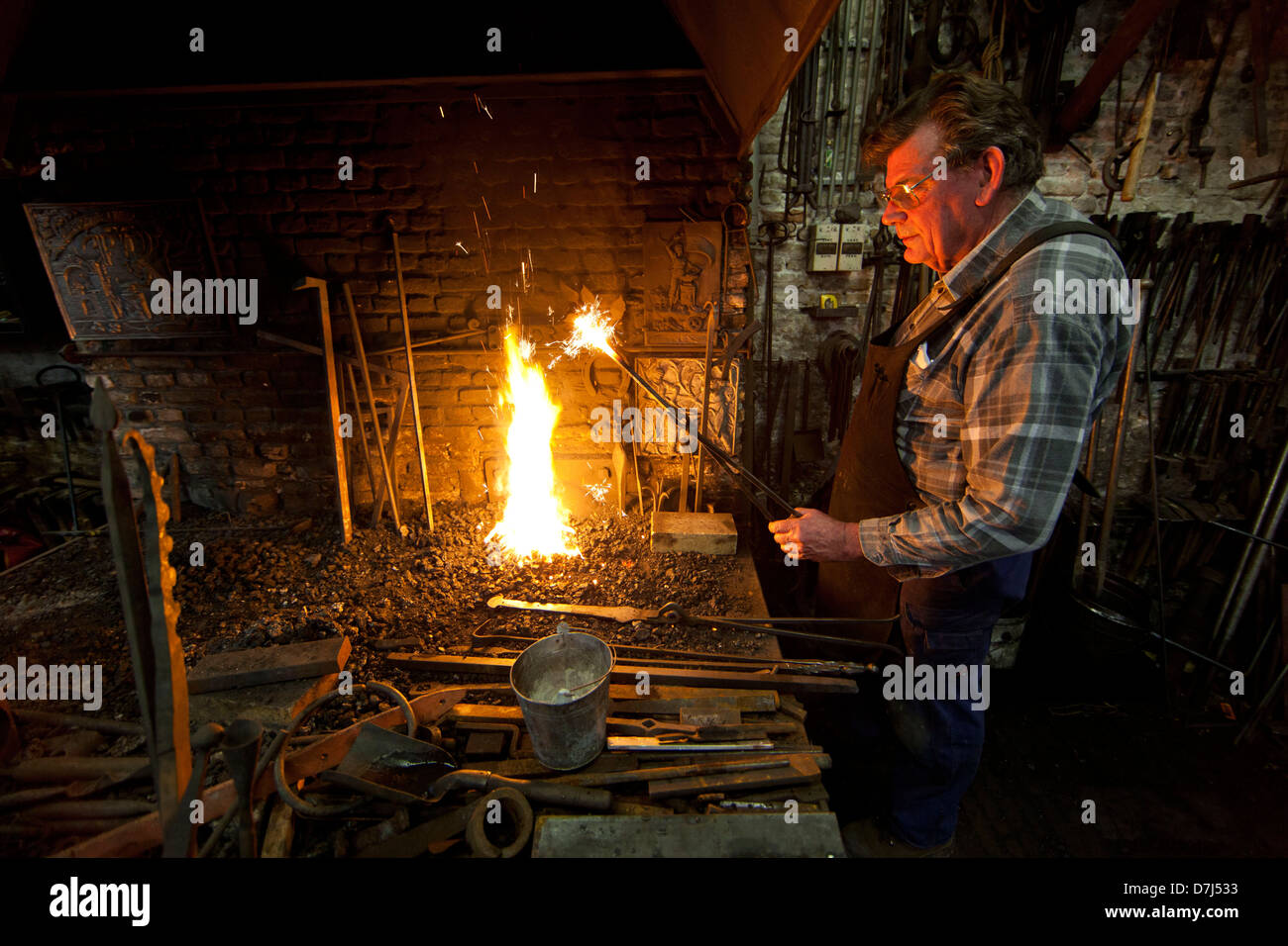 traditional blacksmith at work in Holland Stock Photo - Alamy