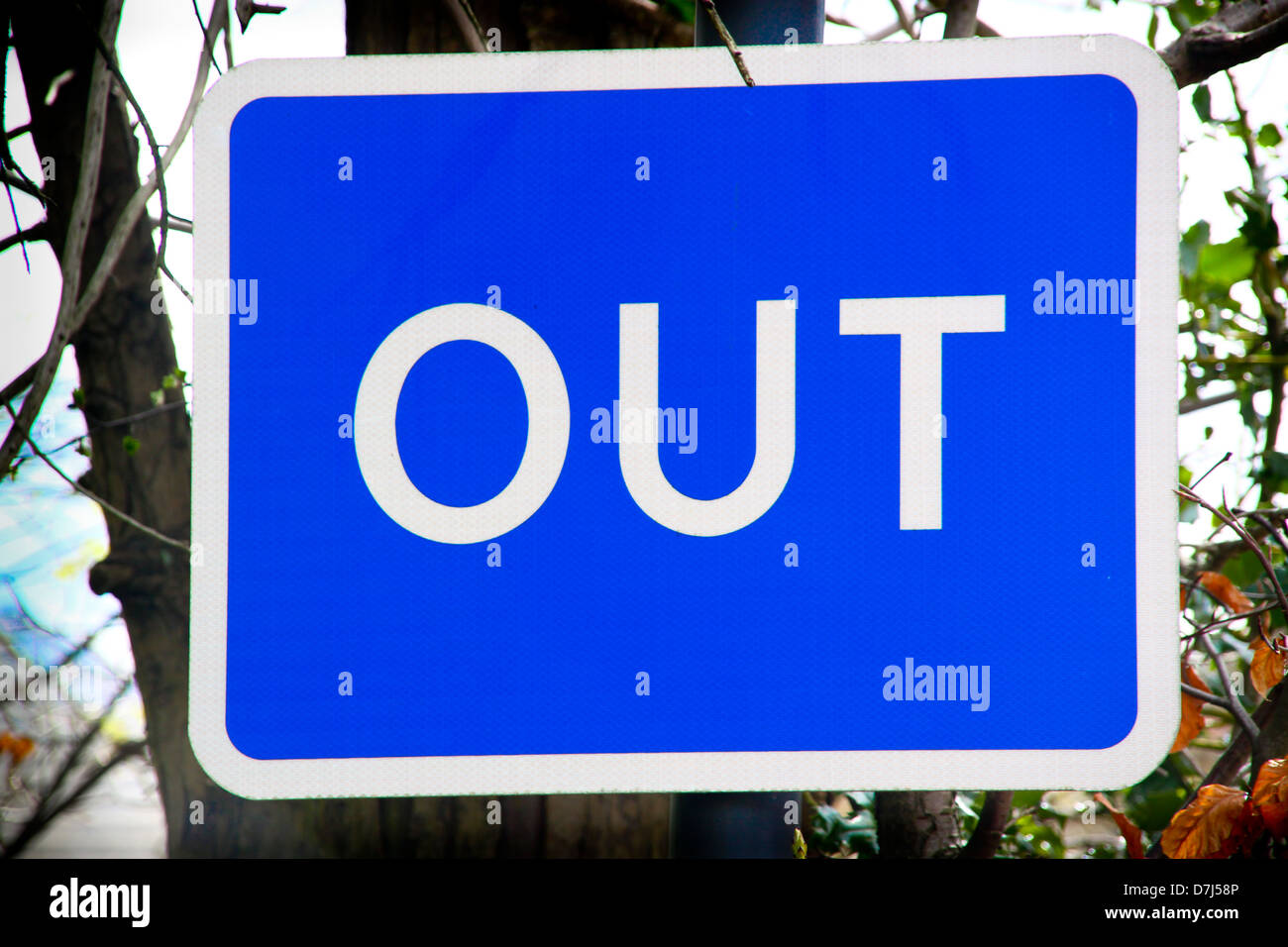 Out traffic sign white letters on blue background Stock Photo - Alamy