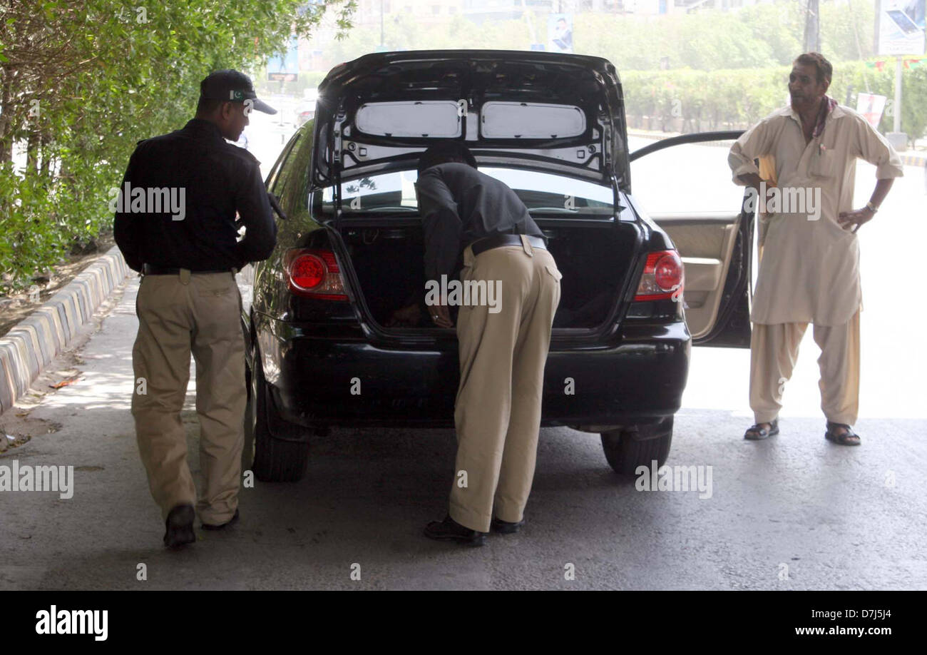 Police official busy in searching vehicles during snap checking as the ...