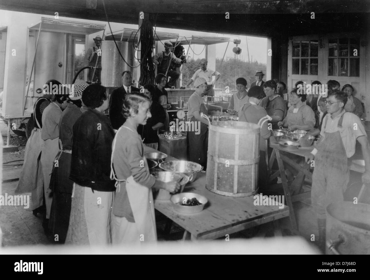 This historical photograph showcases a portable cannery used in the ...