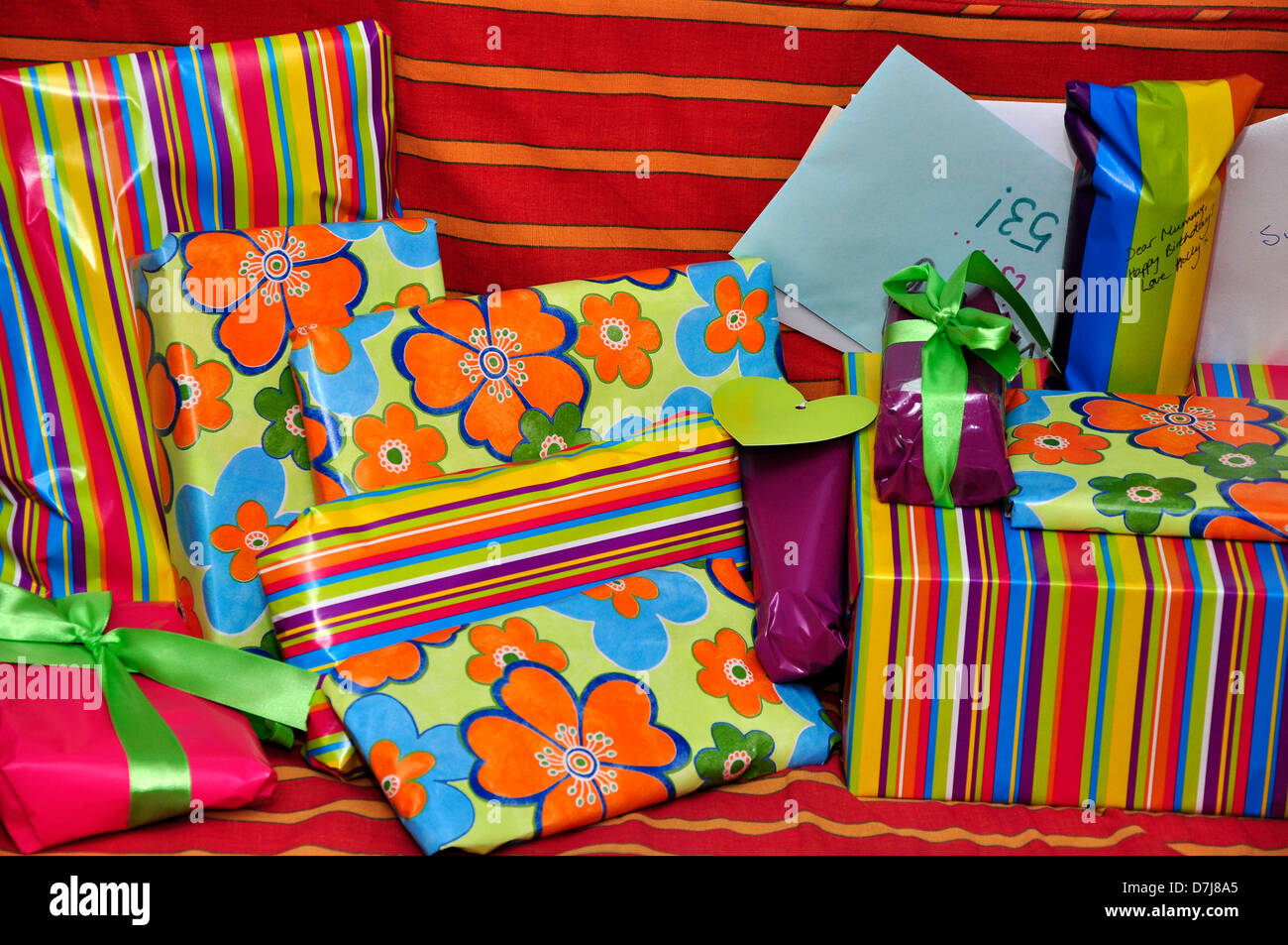 A collection of colourfully wrapped presents Stock Photo - Alamy