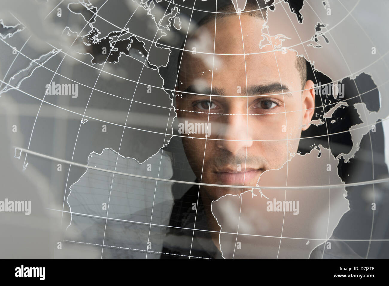 Digital portrait of young man on world map Stock Photo - Alamy