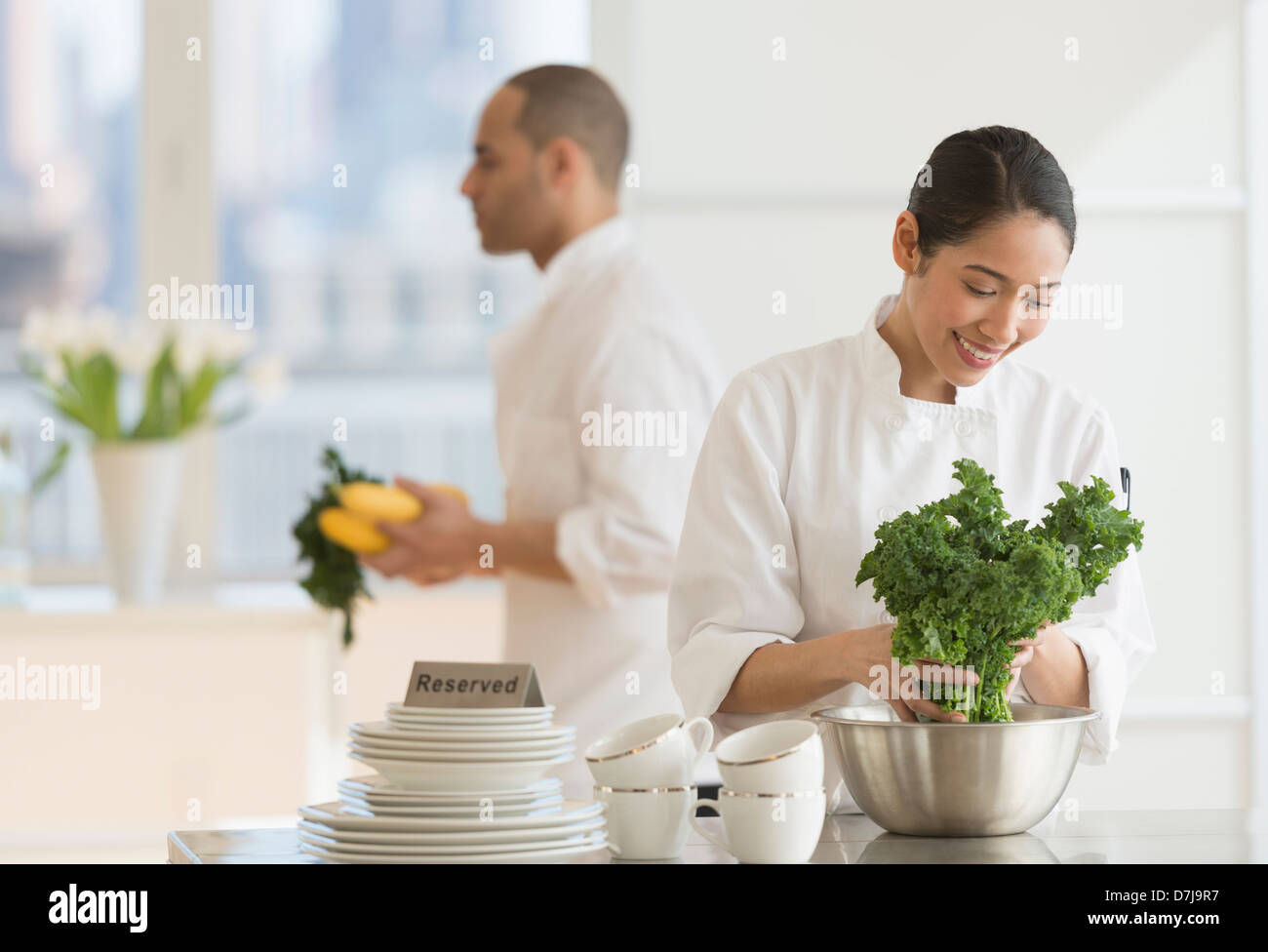 Couple during preparations in kitchen of their own restaurant Stock ...