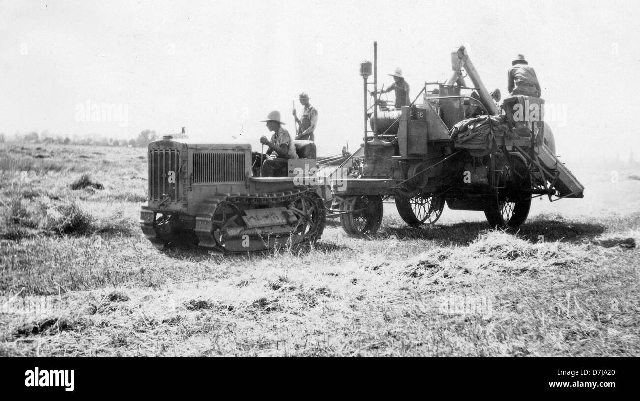 This historical photograph illustrates farm machinery used for haying ...