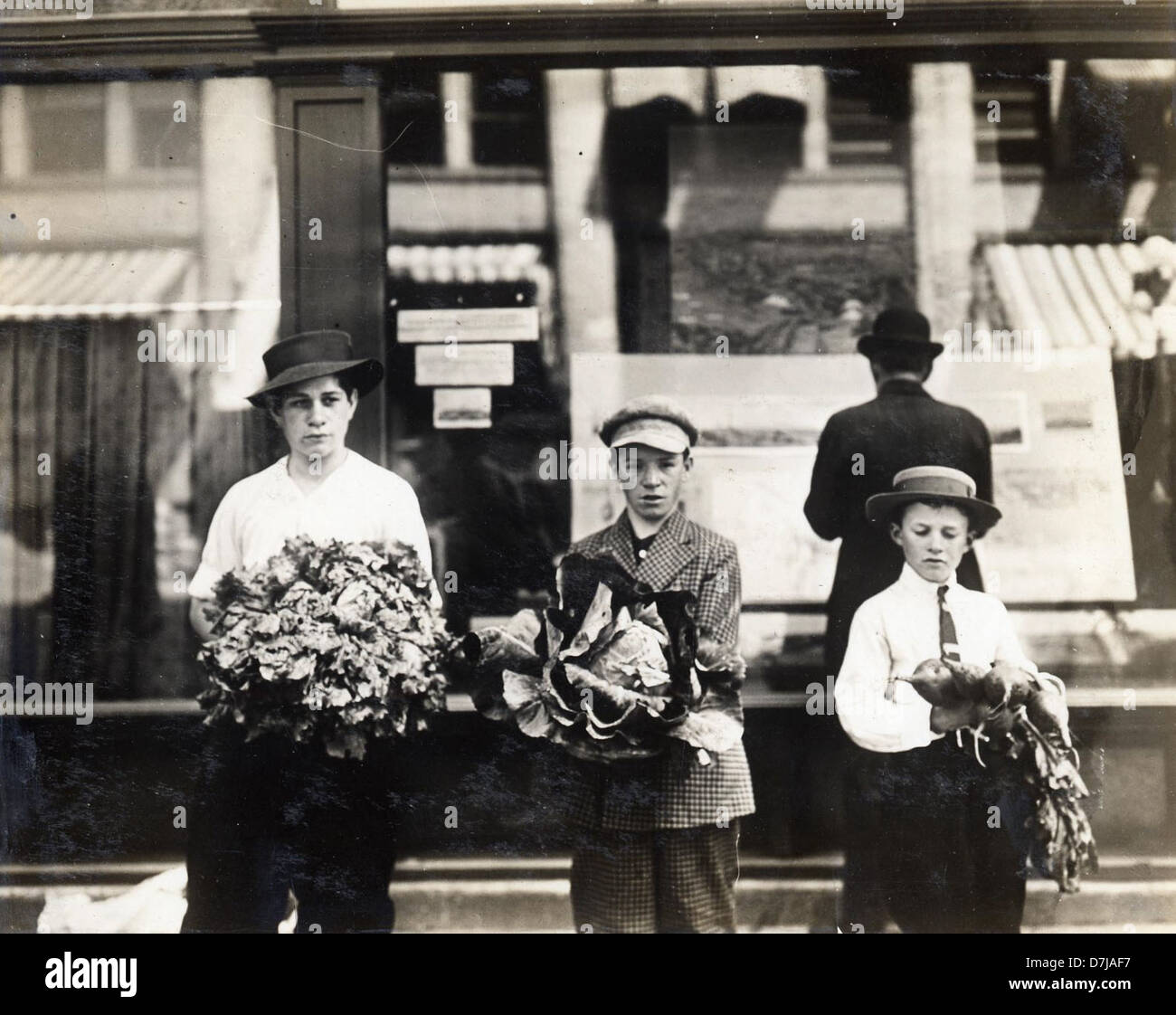 This photograph from circa 1914 shows children with produce, likely ...