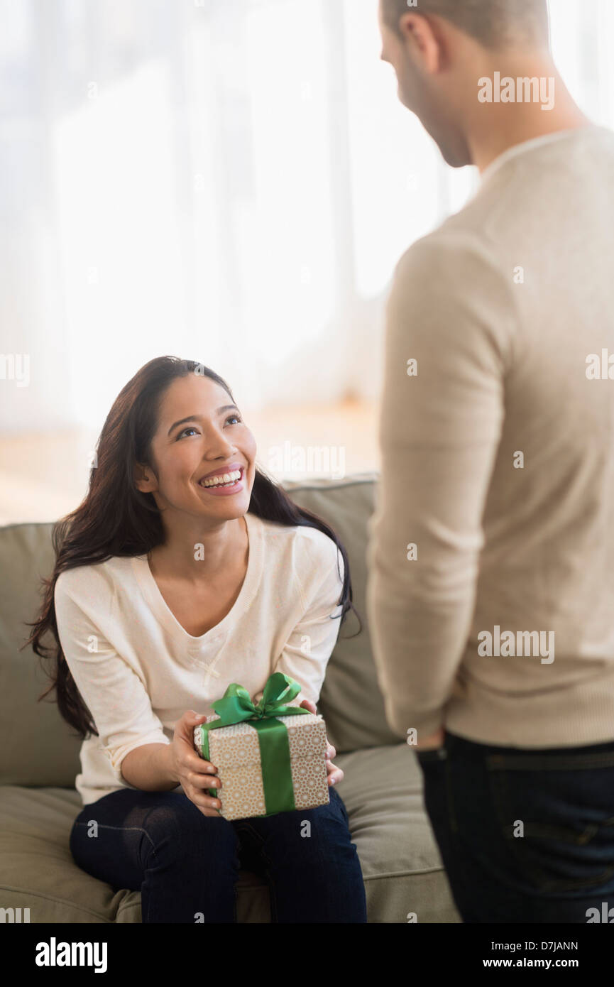 Woman receiving wrapped present Stock Photo - Alamy