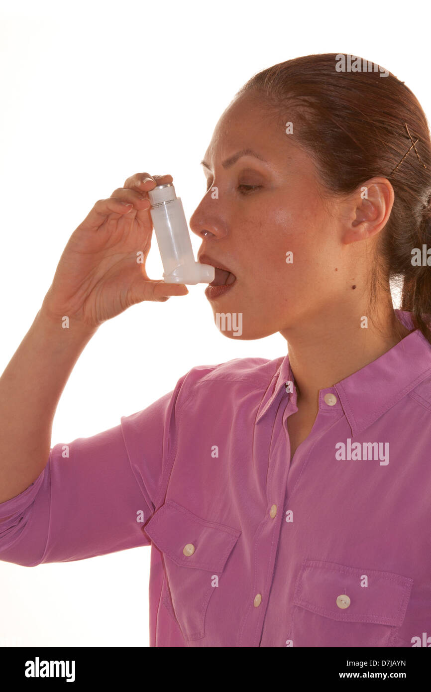 Woman holding inhaler Stock Photo - Alamy