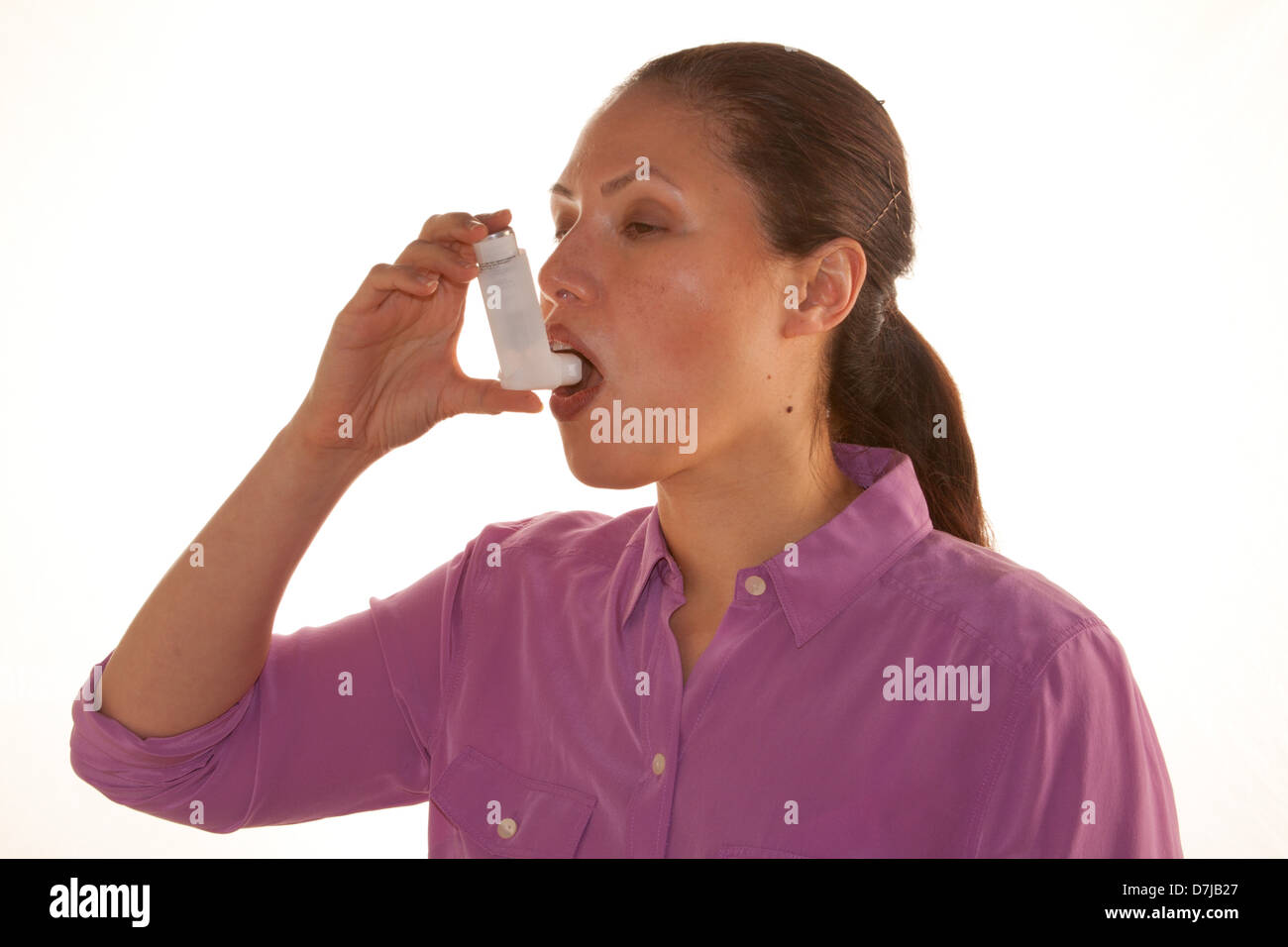 Woman holding inhaler Stock Photo - Alamy