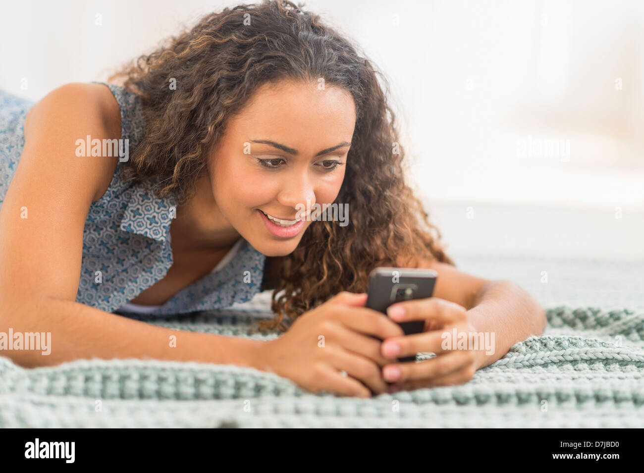 Woman using phone home hi-res stock photography and images - Alamy