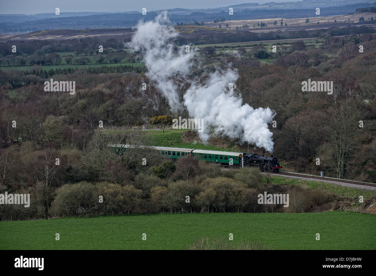 Swanage steam railway train approaching Corfe Castle railway station ...