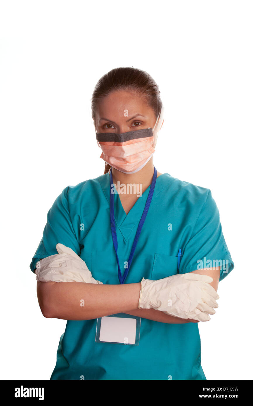 Portrait of a nurse wearing a protective face mask with eye-shield ...