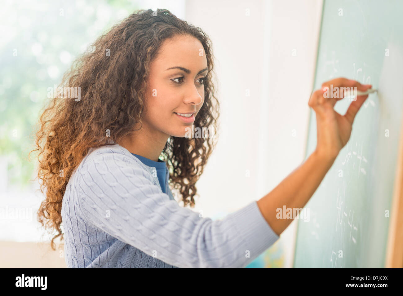 Portrait of elementary school teacher in class Stock Photo - Alamy