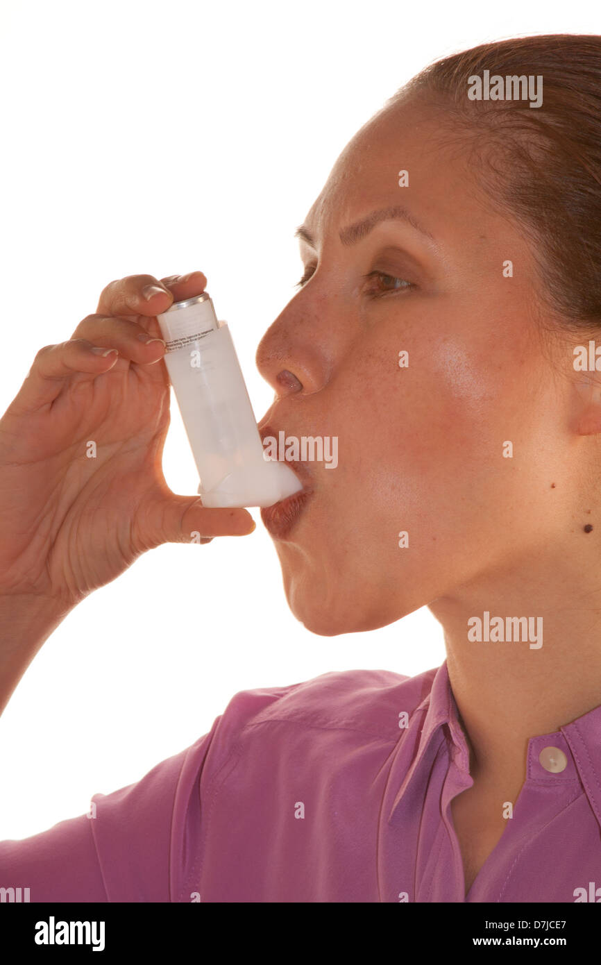 Woman holding inhaler Stock Photo - Alamy