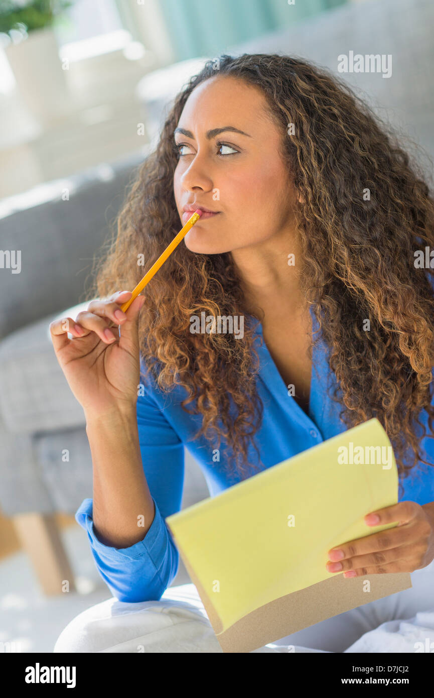 Woman long hair notepad hi-res stock photography and images - Alamy