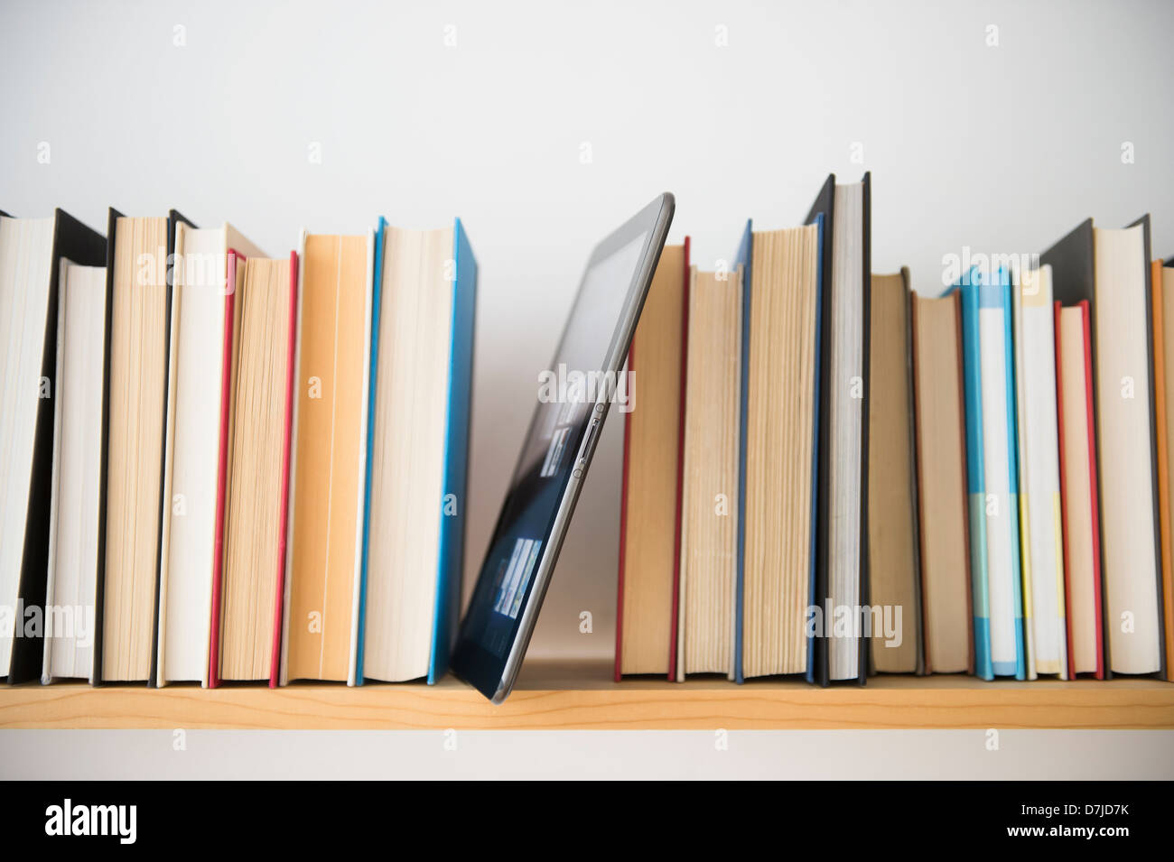 Row of books on shelf Stock Photo - Alamy