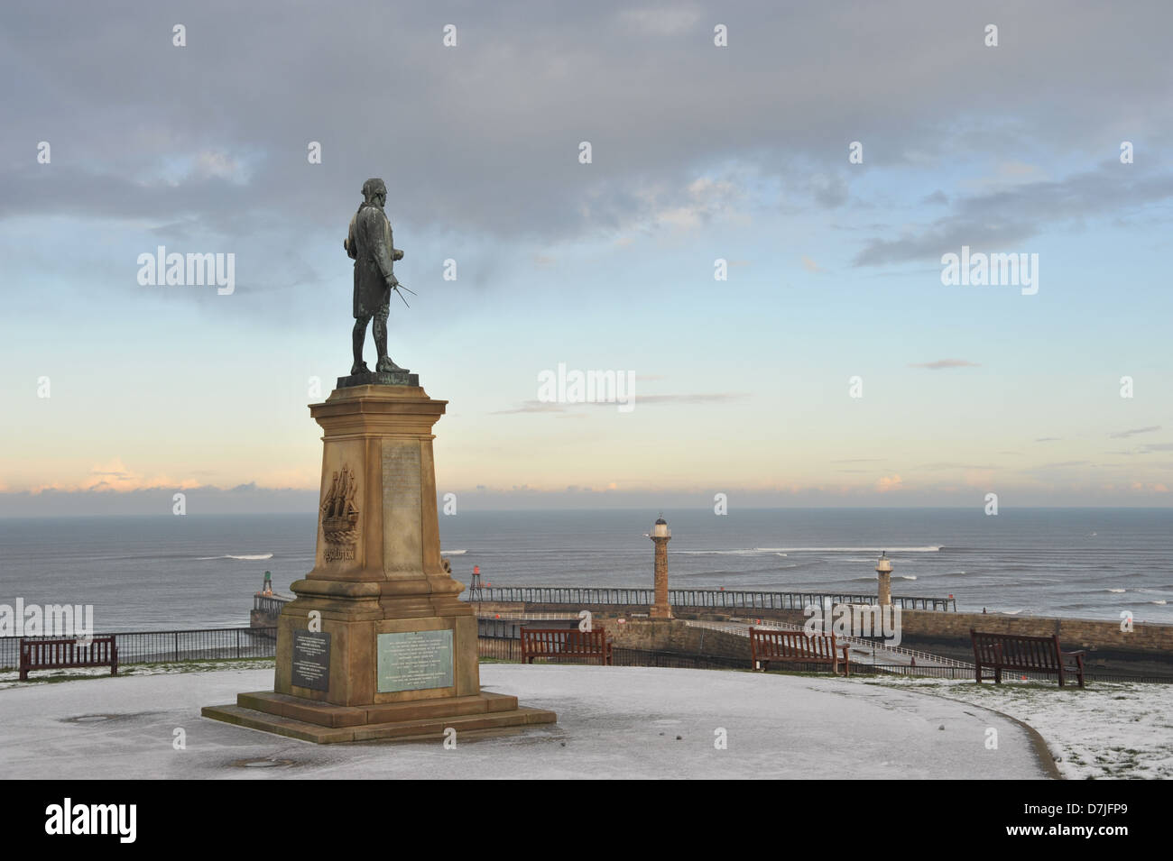Whitby statue, wintery scene,seaside view.lighthouse.harbour.blue skies ...