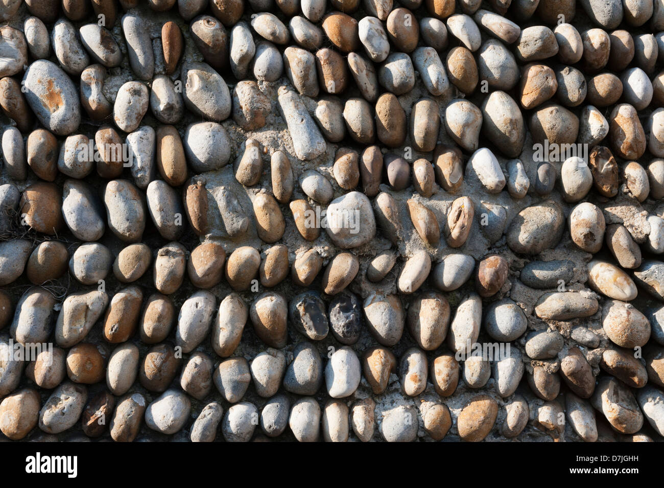 Detail of a flint cobbled wall with sidelight given good texture. Could ...