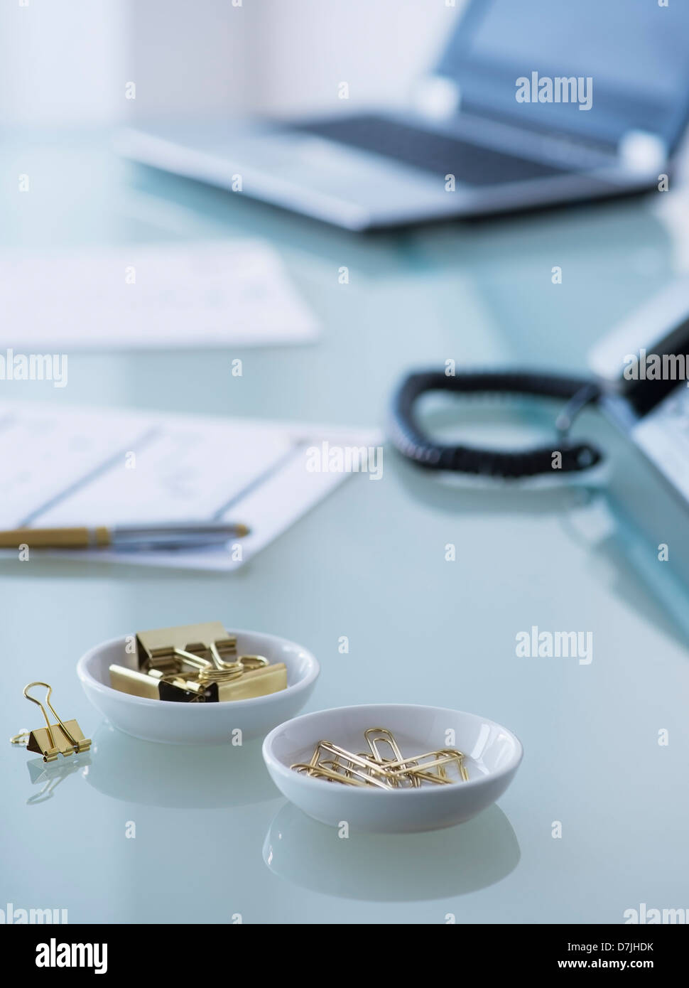 View of paper clips, binder clip, paper material and laptop Stock Photo ...