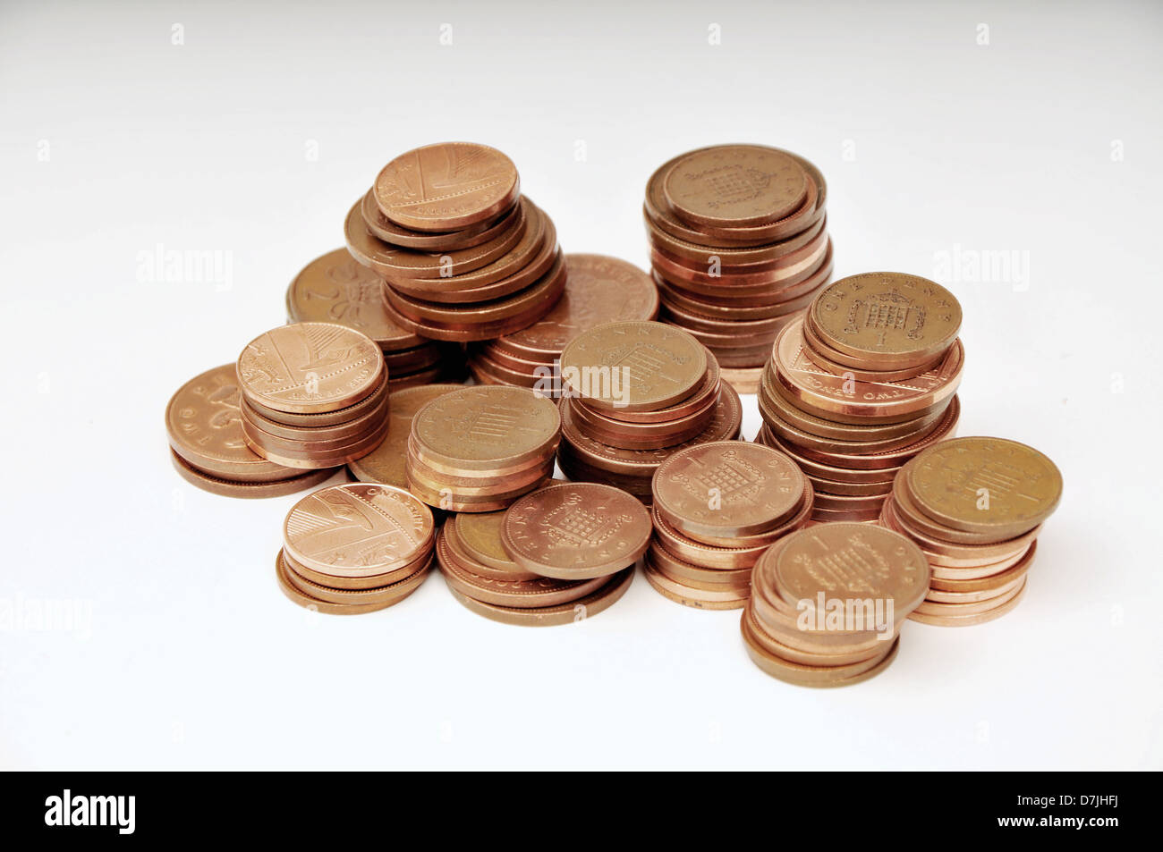 Stacks of British copper coins against a plain background Stock Photo ...