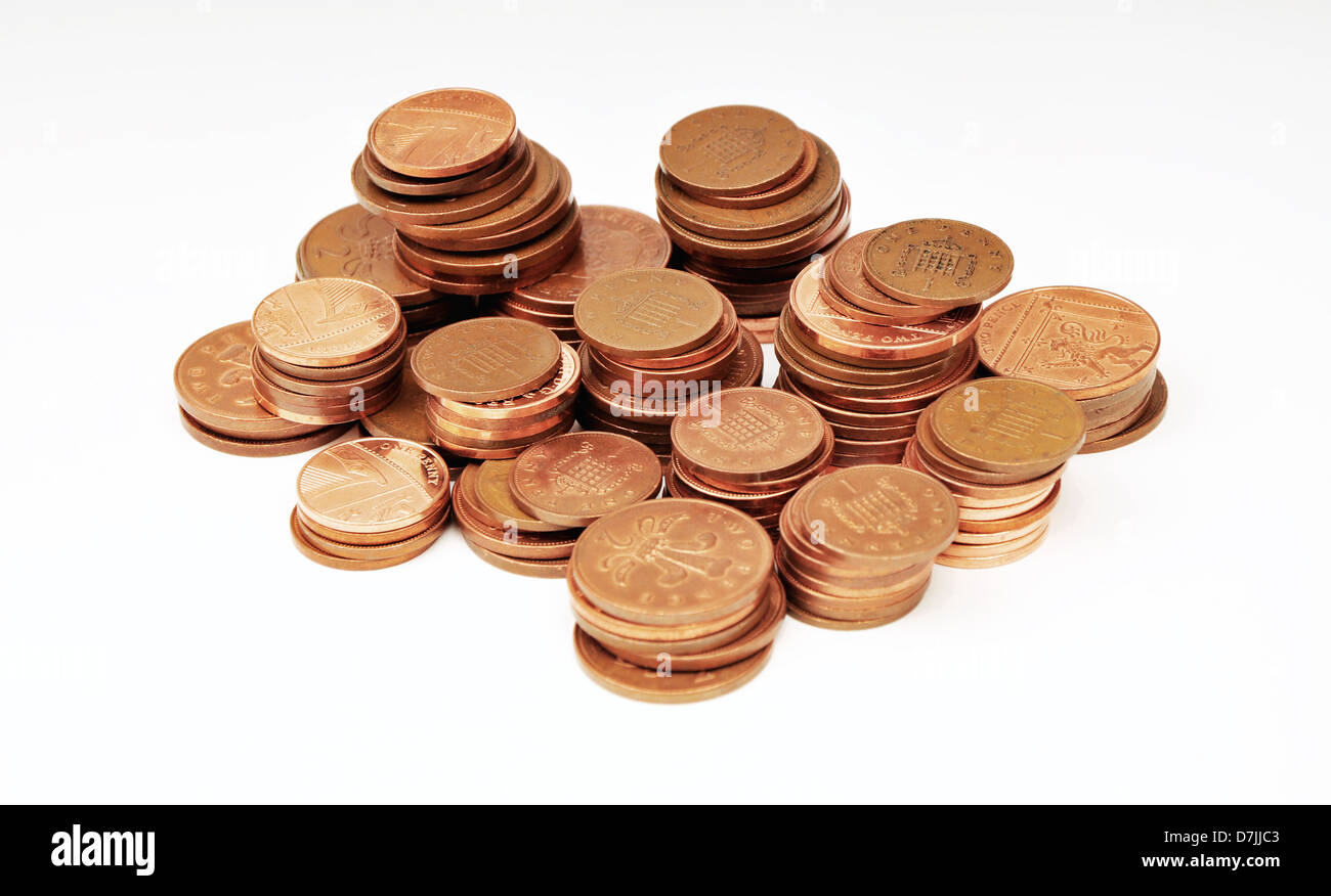 Stacks of British copper coins against a plain background Stock Photo ...