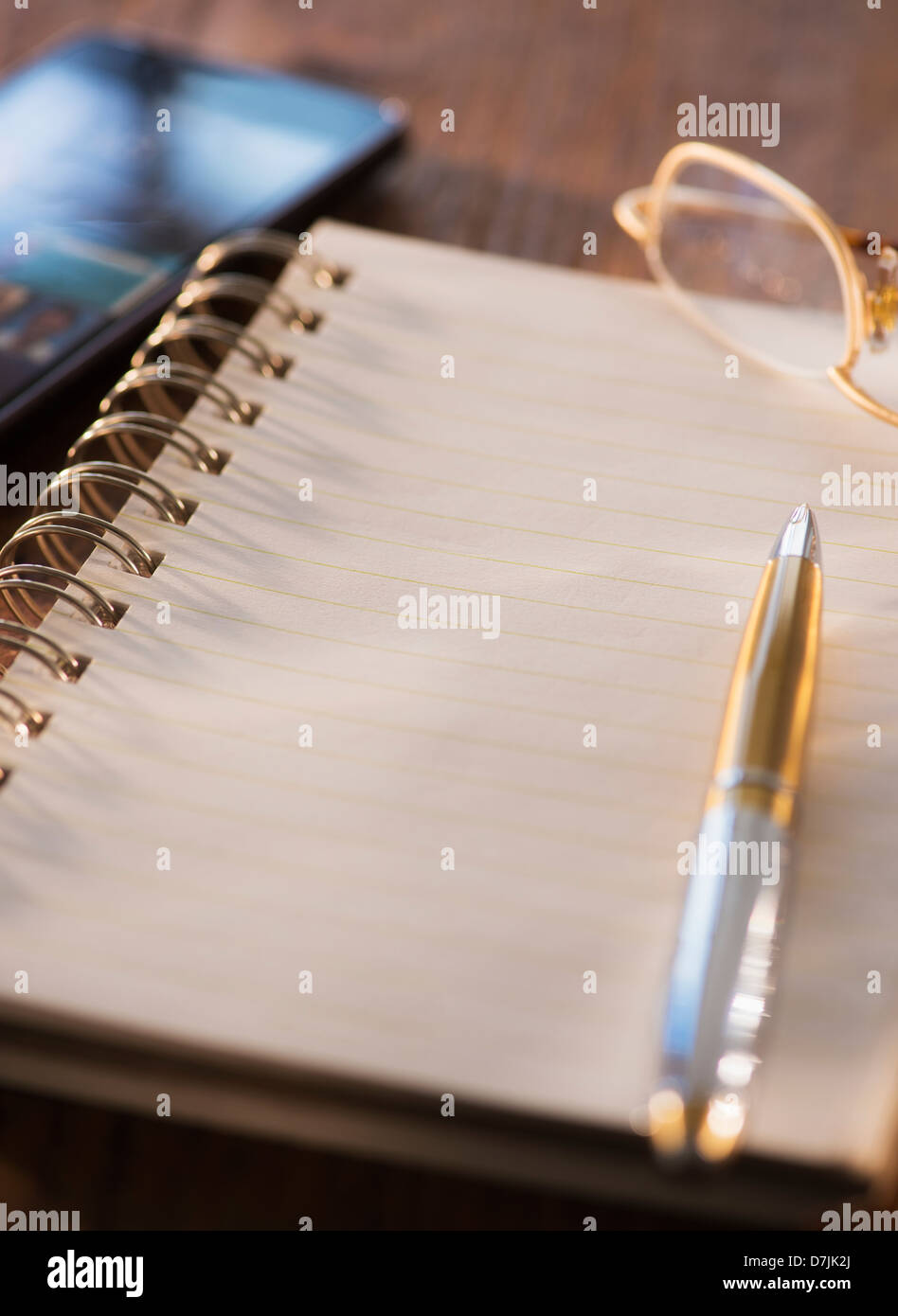 Studio Shot spiral-bound notebook and pen Stock Photo - Alamy