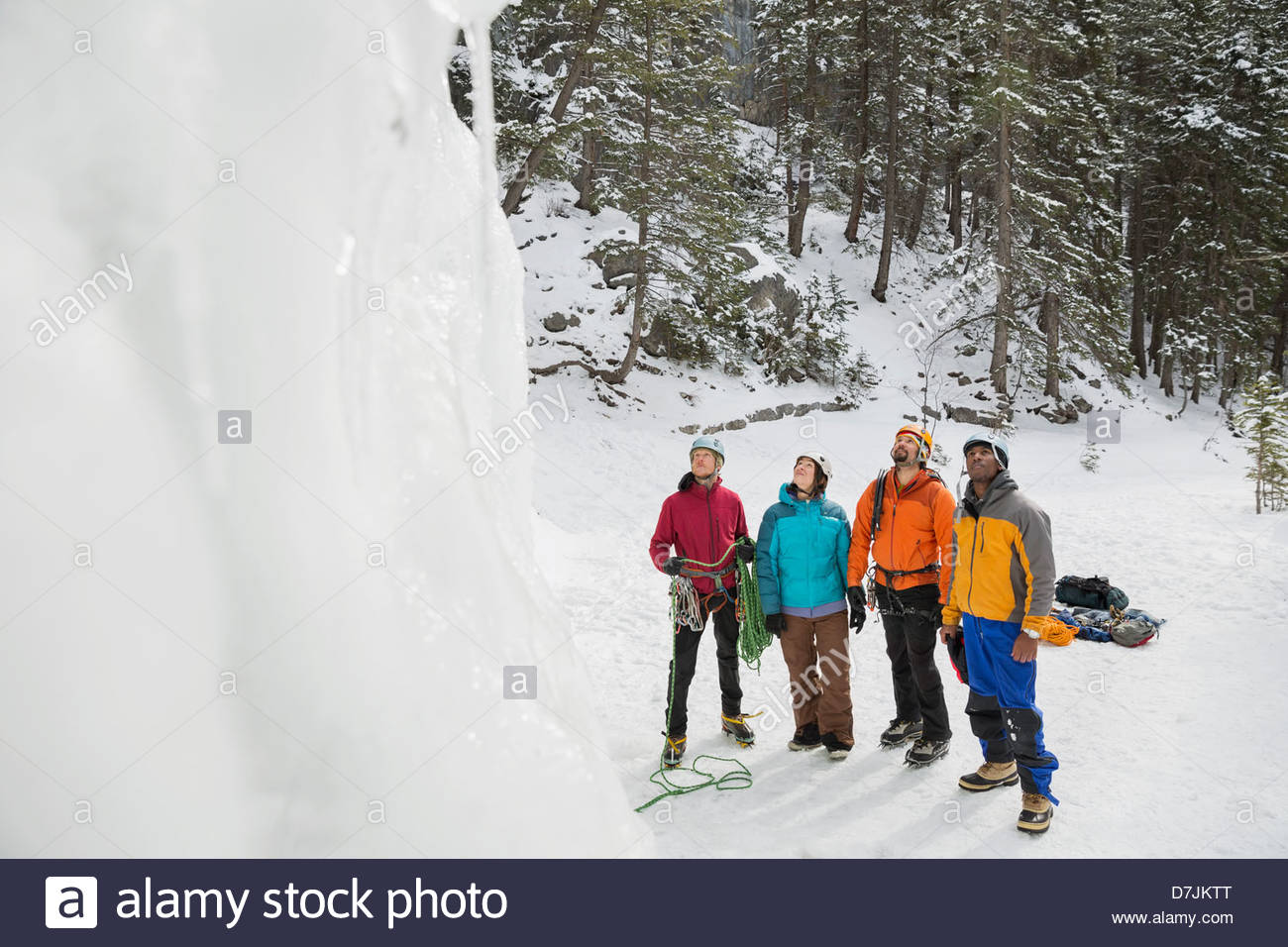 Group of friends preparing to ice climb in mountains Stock Photo - Alamy