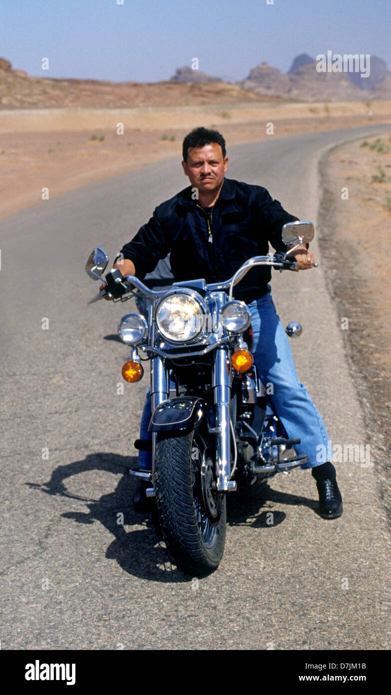 King Abdullah II of Jordan riding his motorcycle in Wadi Rum Stock ...