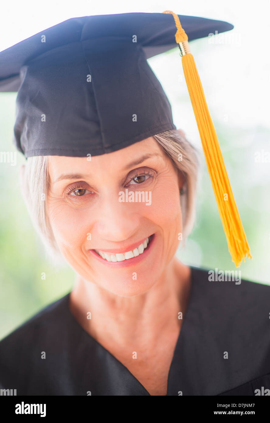 Portrait of woman in graduation cap Stock Photo - Alamy