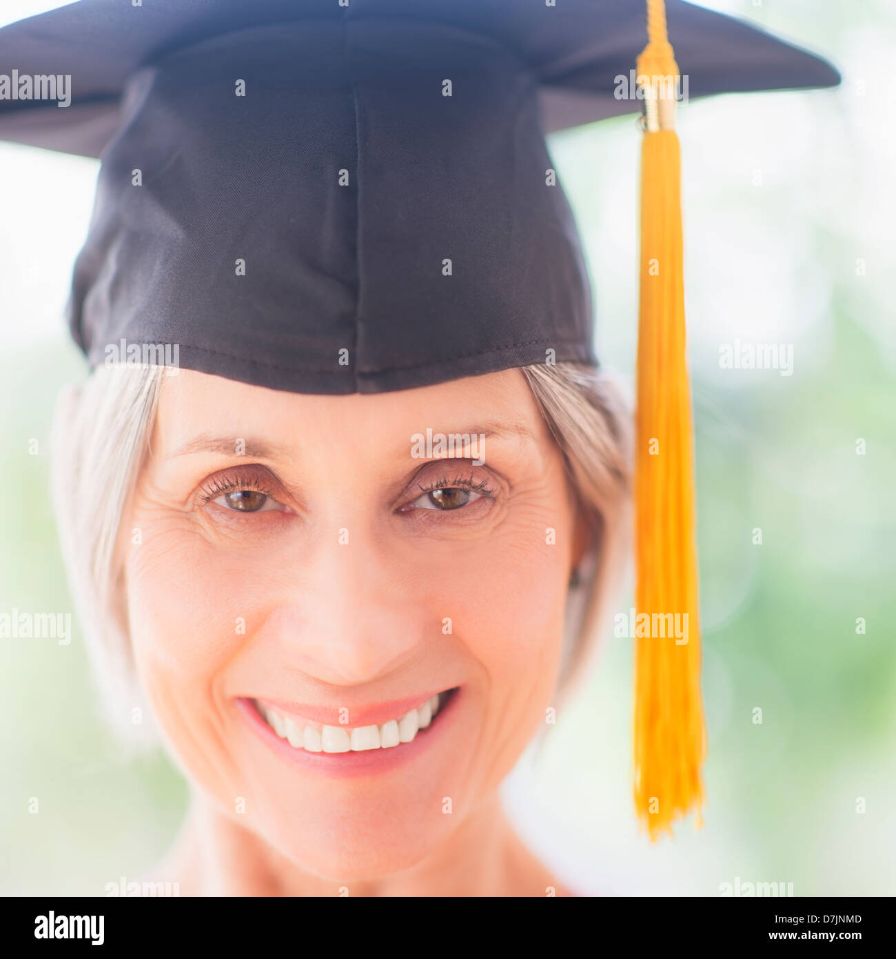 Portrait of woman in graduation cap Stock Photo - Alamy