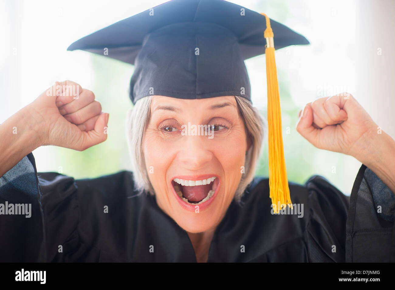Portrait of woman in graduation cap Stock Photo - Alamy