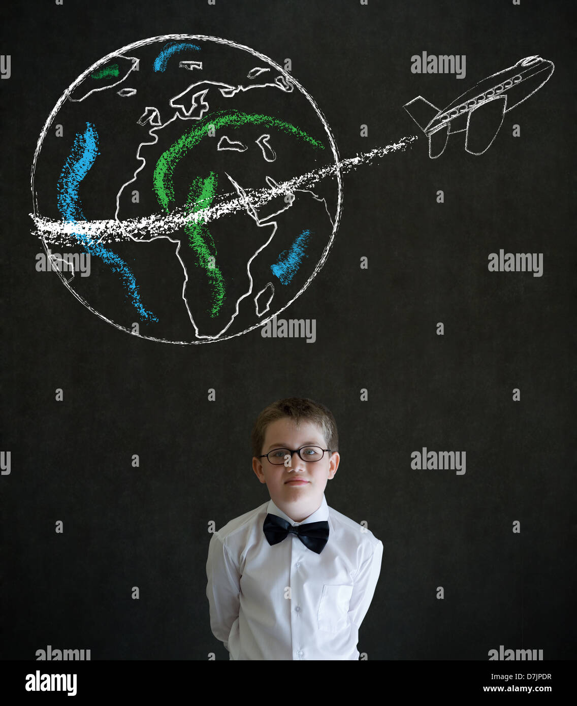 Thinking boy dressed up as business man with chalk globe and jet world ...