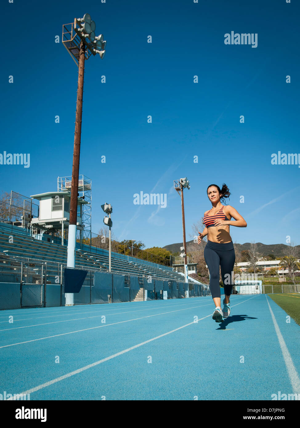 USA, California, Los Angeles, Woman running at sports field Stock Photo ...