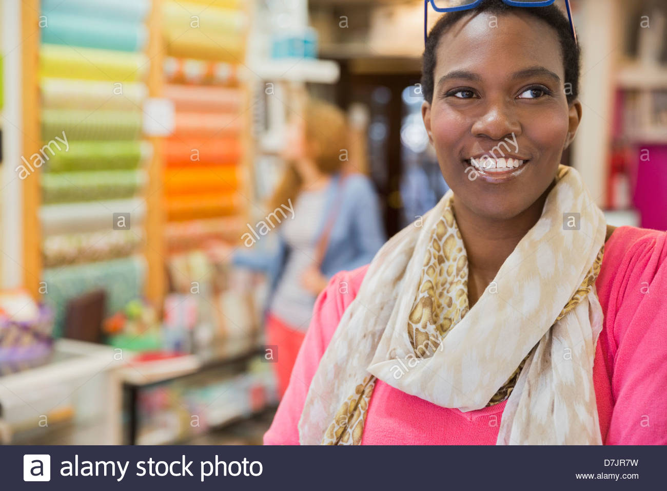 Smiling female small business owner standing in store Stock Photo - Alamy