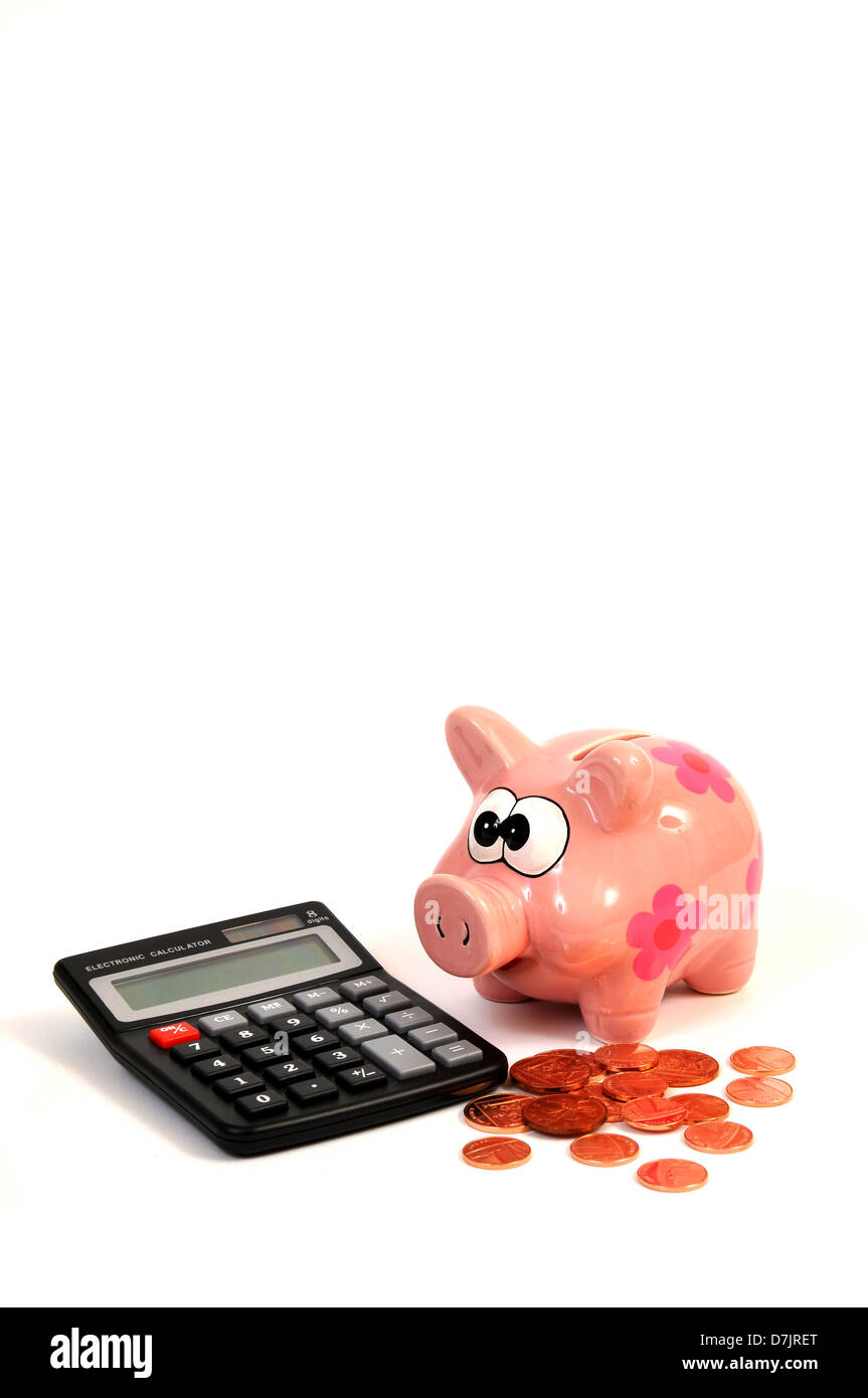 Piggy bank with coins and a calculator against a white background Stock ...