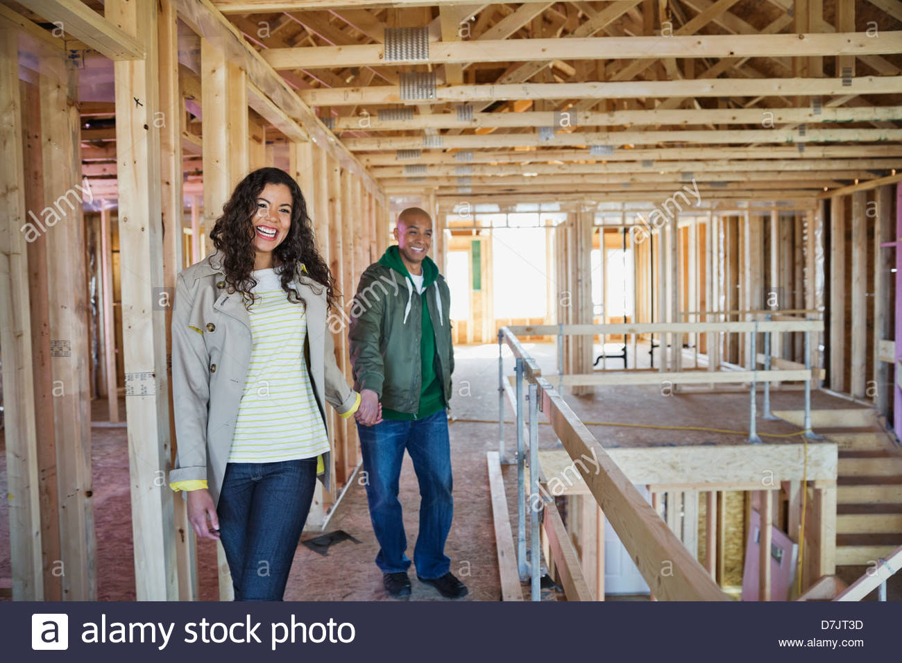 Young couple visiting new home construction site Stock Photo - Alamy