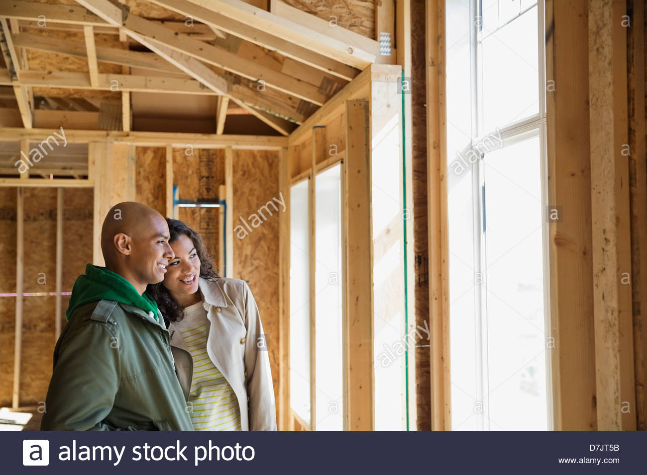 Young couple visiting new home construction site Stock Photo - Alamy