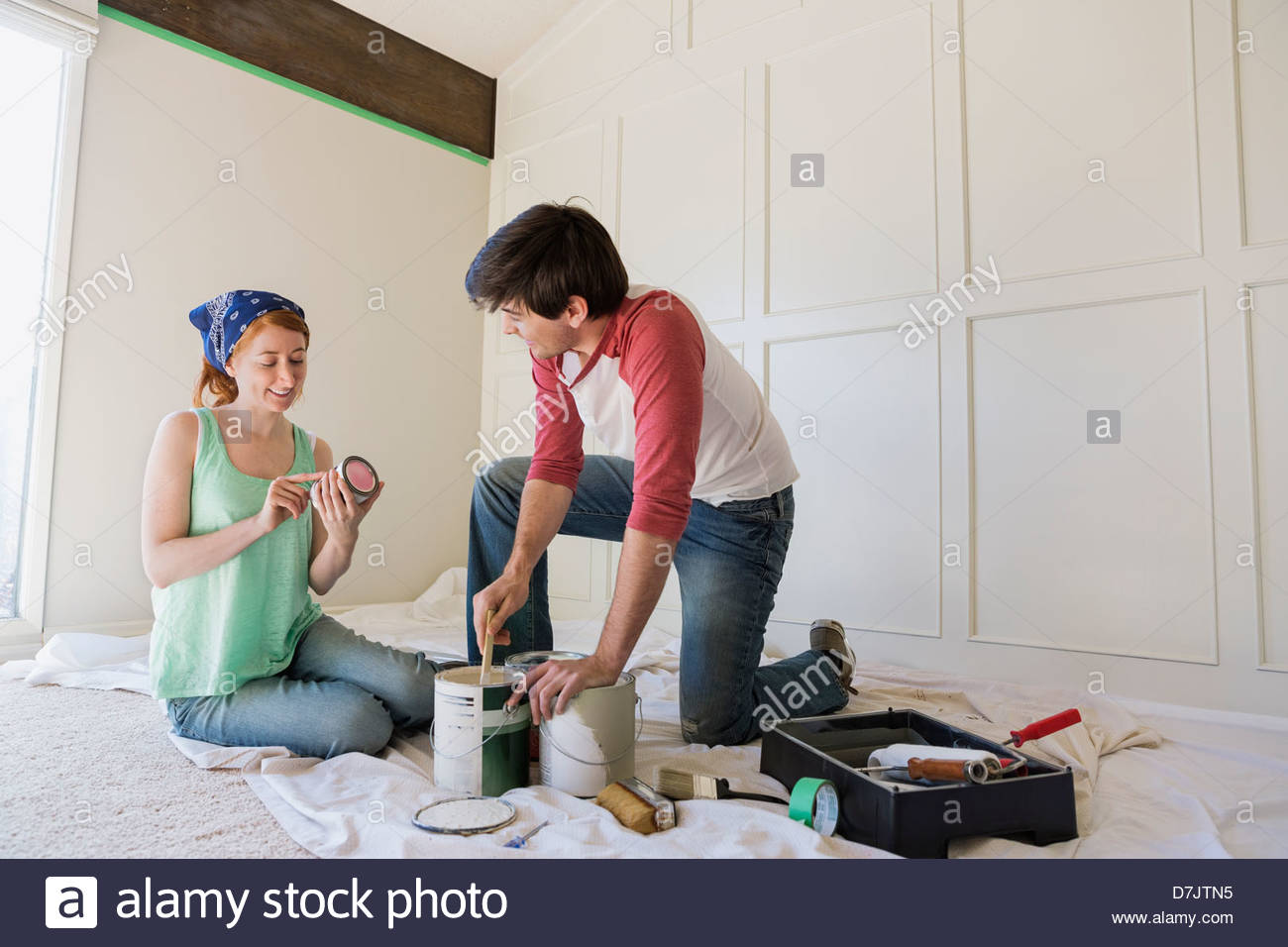 Young couple preparing to paint at home Stock Photo - Alamy