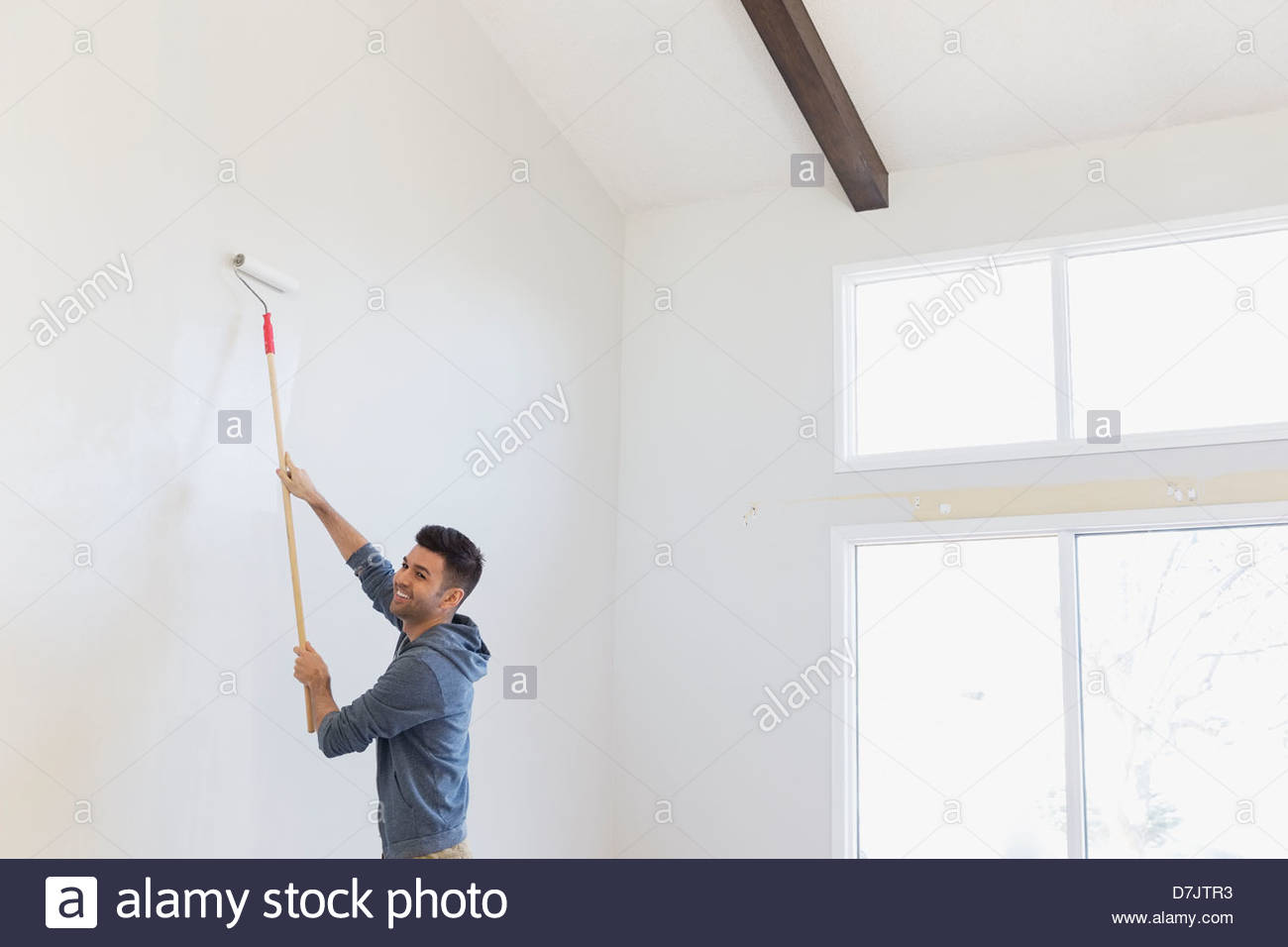 Man painting house wall hi-res stock photography and images - Alamy