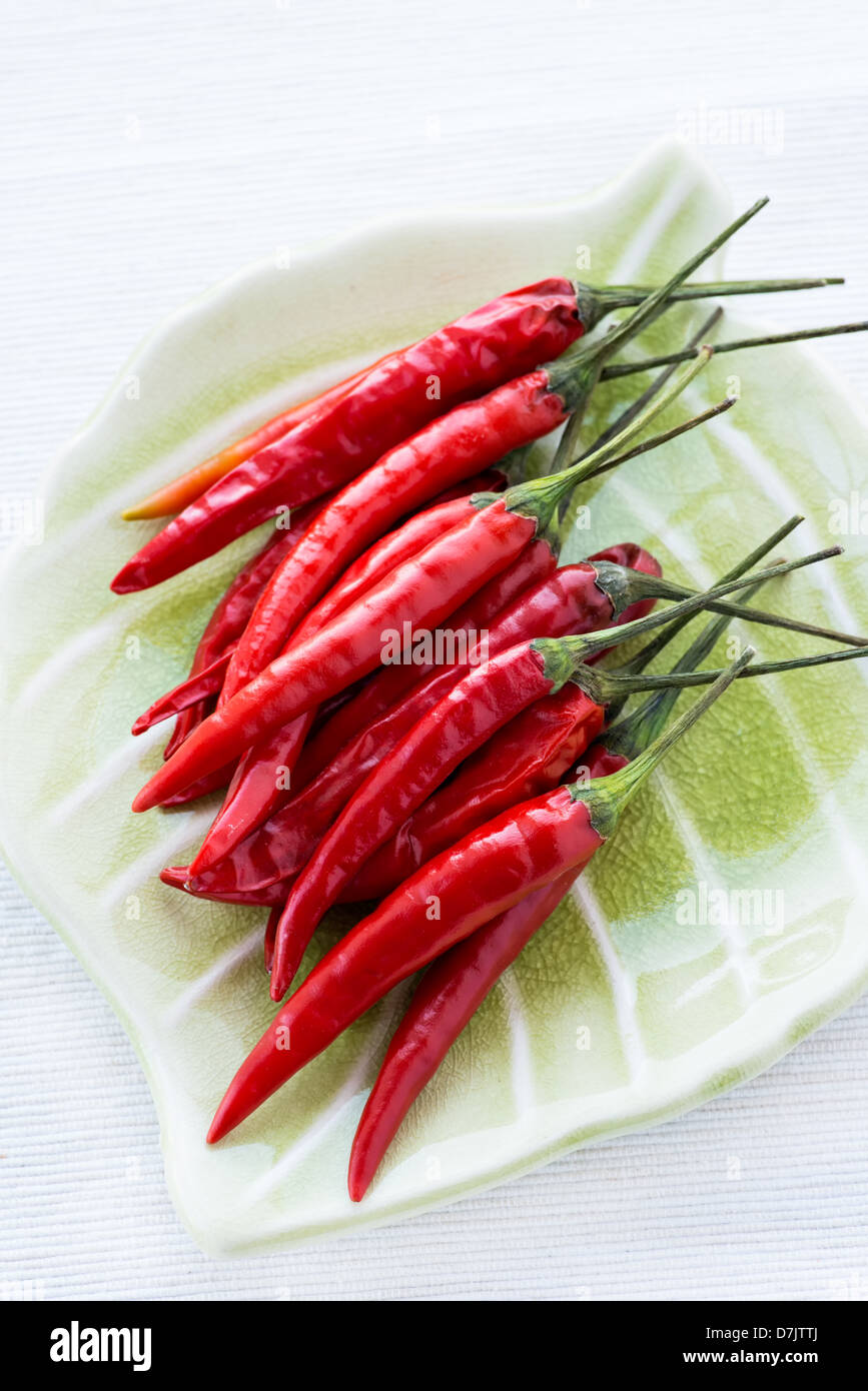 Red chili peppers on plate hi-res stock photography and images - Alamy