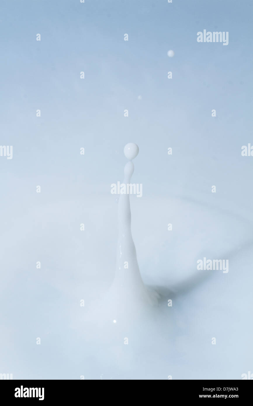 Close view of a droplet of milk hitting a surface of milk Stock Photo ...