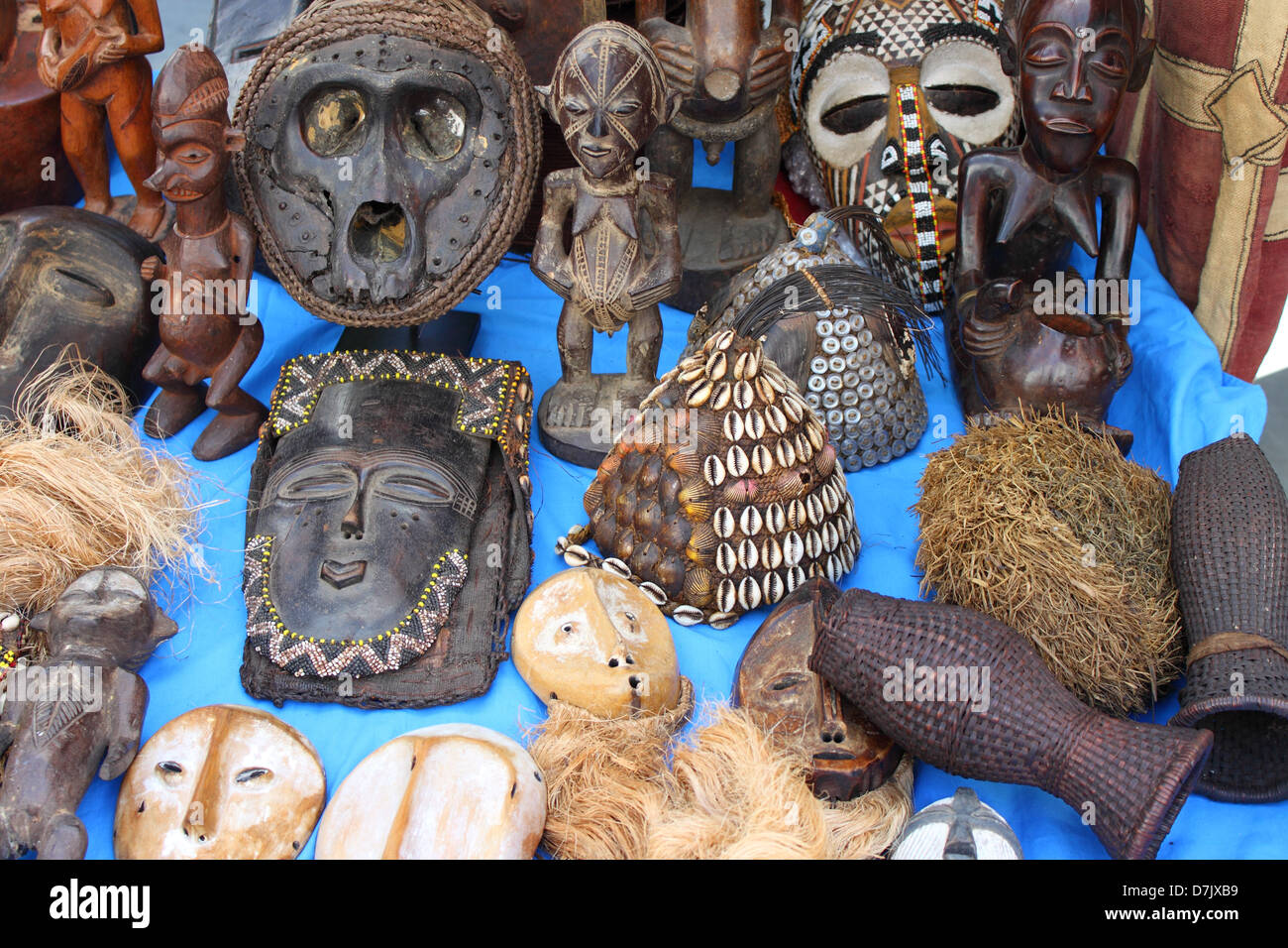 Traditional african masks sold in a market stall Stock Photo - Alamy