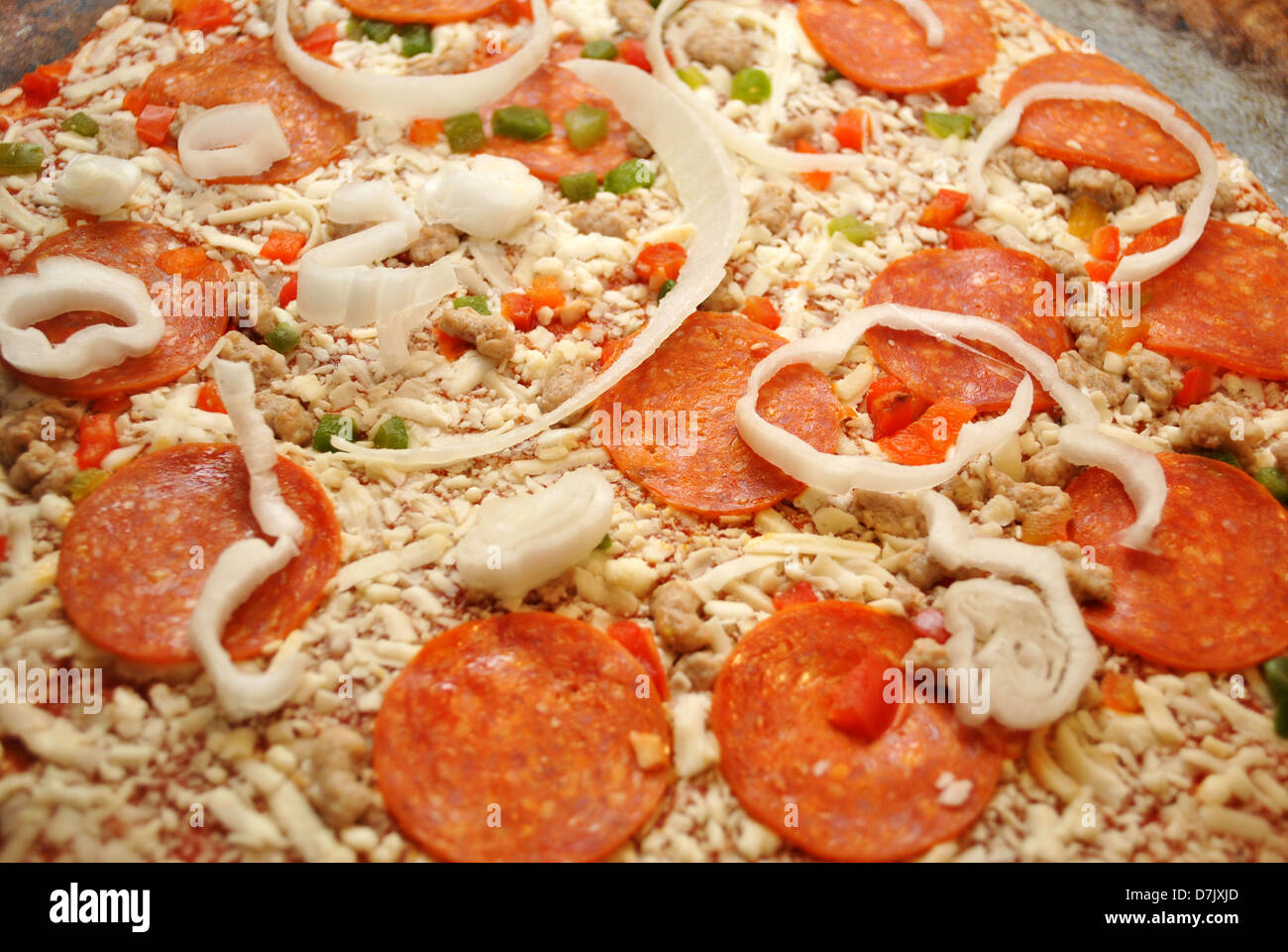 Raw Pepperoni and Onion Pizza Stock Photo - Alamy