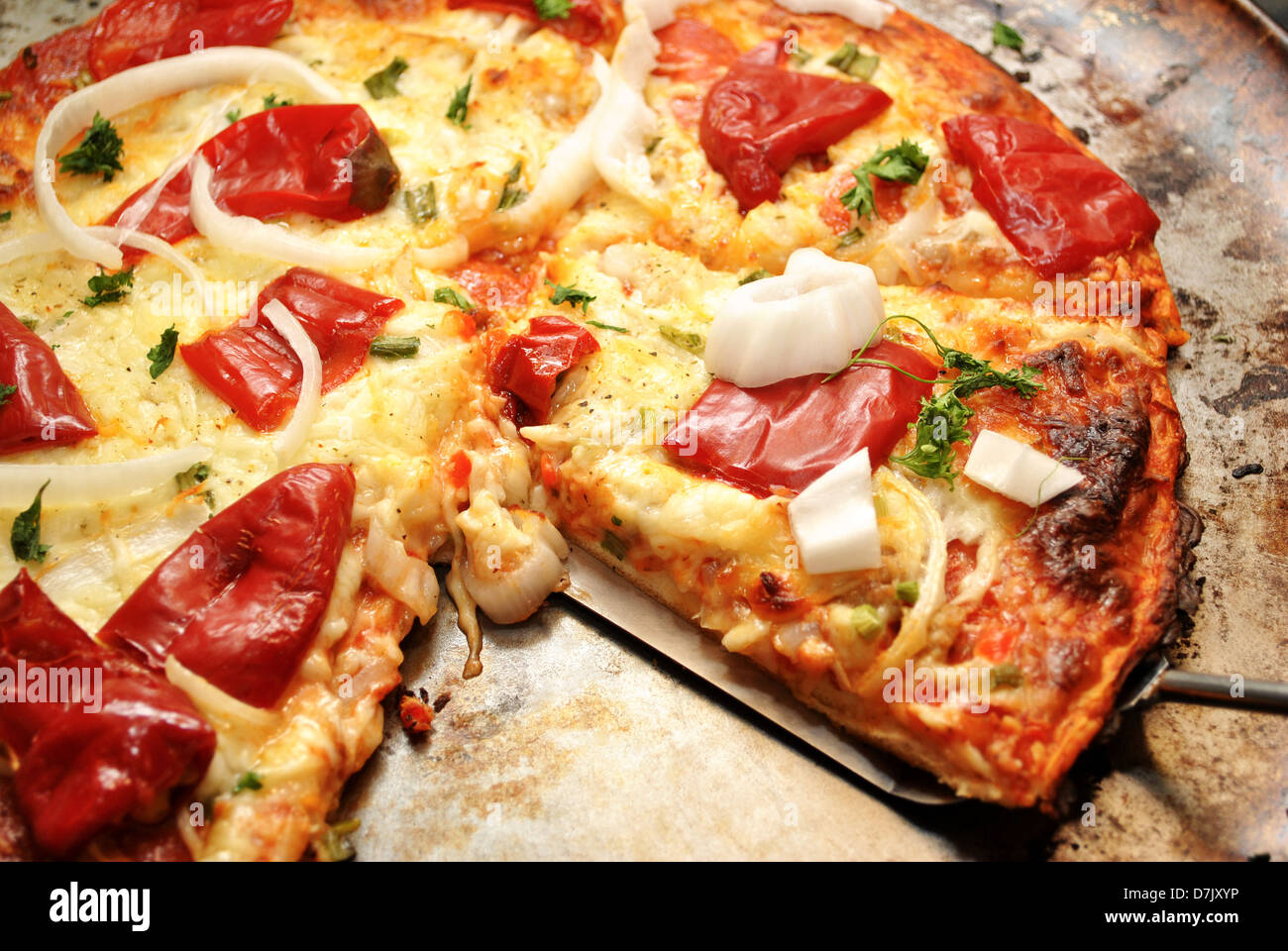 Eating Roasted Red Pepper Pizza Slices Stock Photo - Alamy