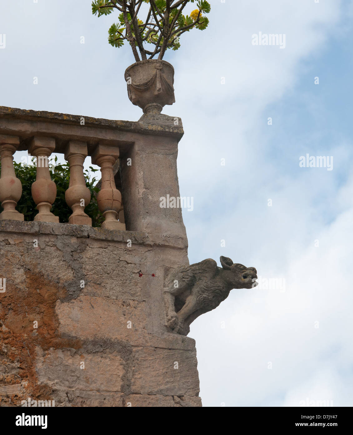 Detail of a rural old finca with gargoyle in the corner and sky as copy ...